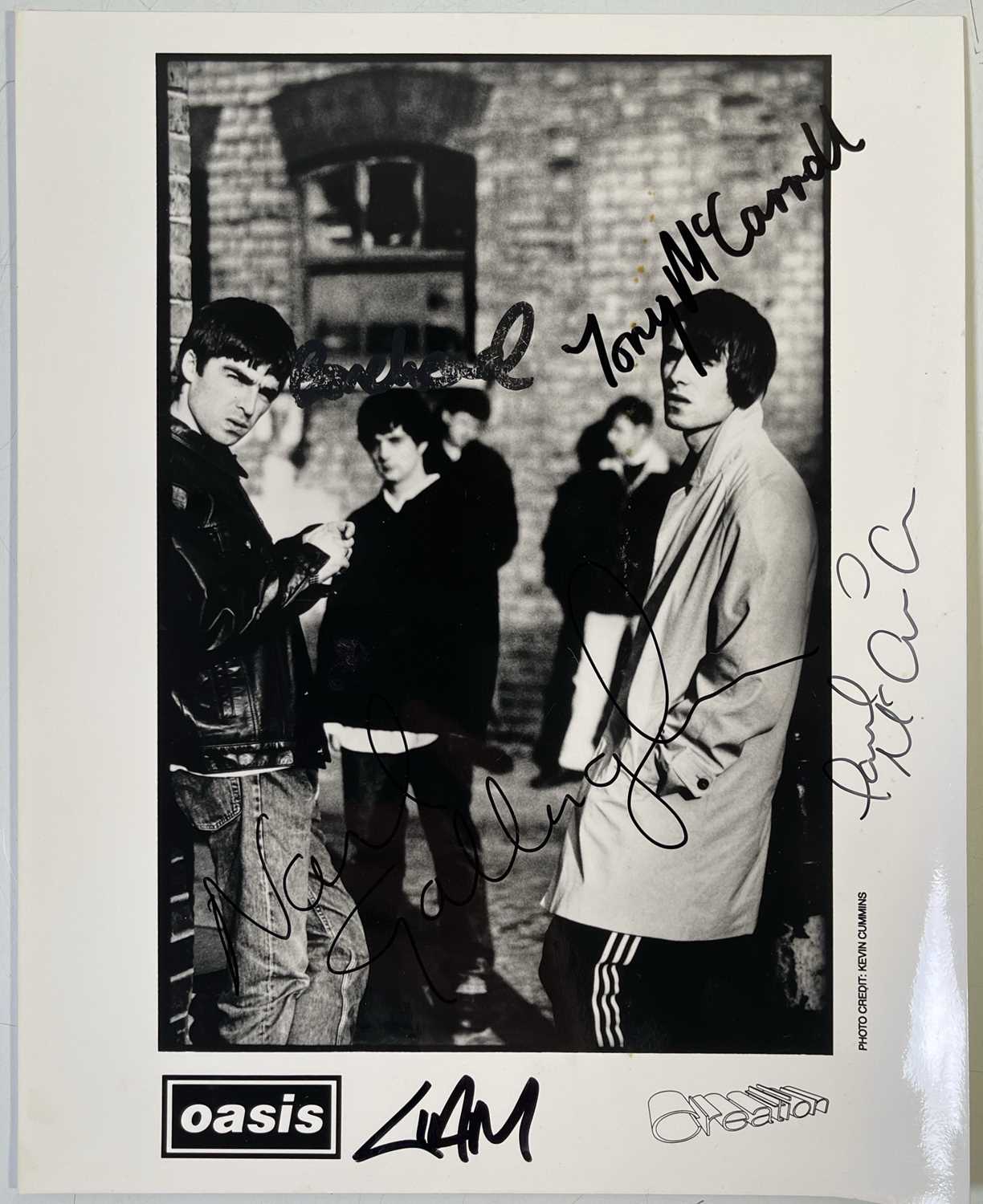 Lot 519 - OASIS - FULLY SIGNED CREATION PROMO PHOTO.